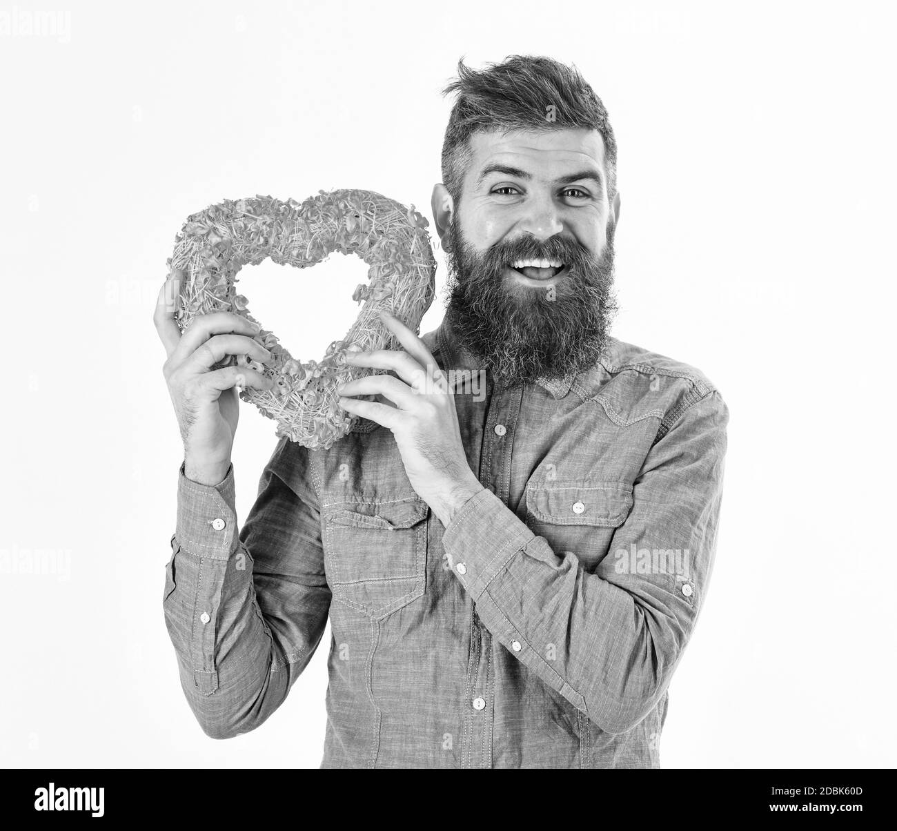 Macho in love, shows his romantic feelings. Man with happy face holds ...