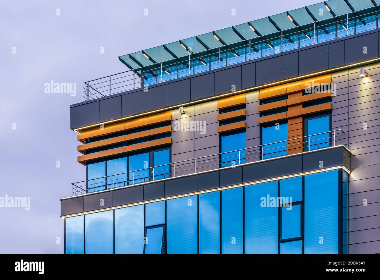 Modern high-rise office building with a glass facade at overcast ...