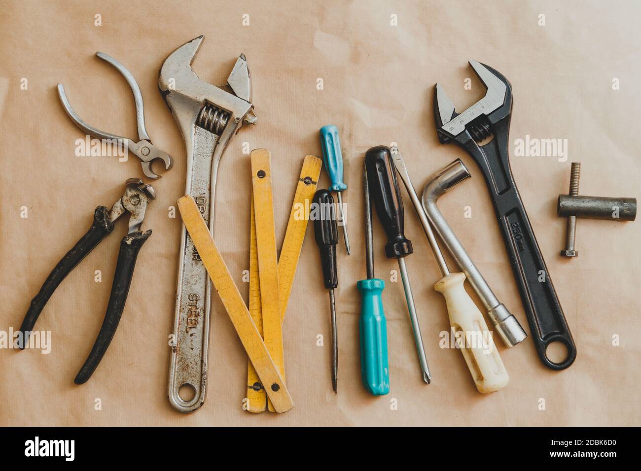 Set of hand tools on craft paper background Stock Photo - Alamy