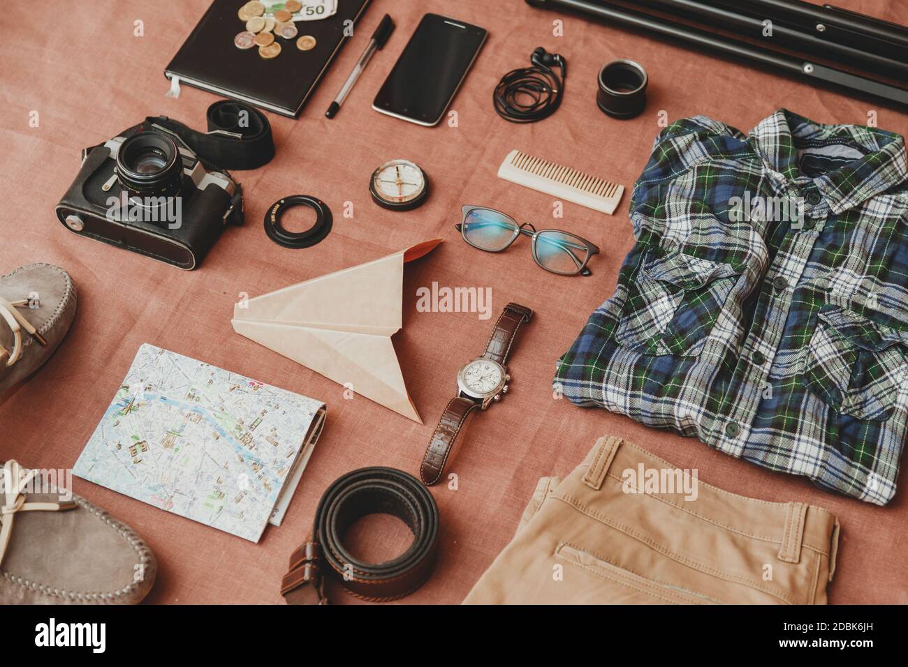 Trip concept - set of cool photography man stuff on linen cloth ...