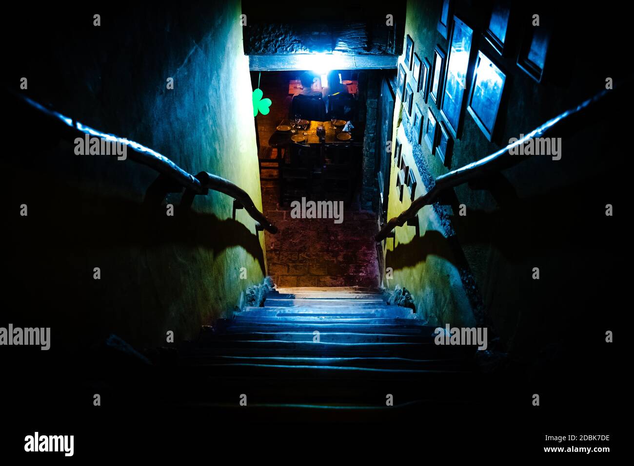 Dramatic point of view of scary stairs from upside into darkness of ...