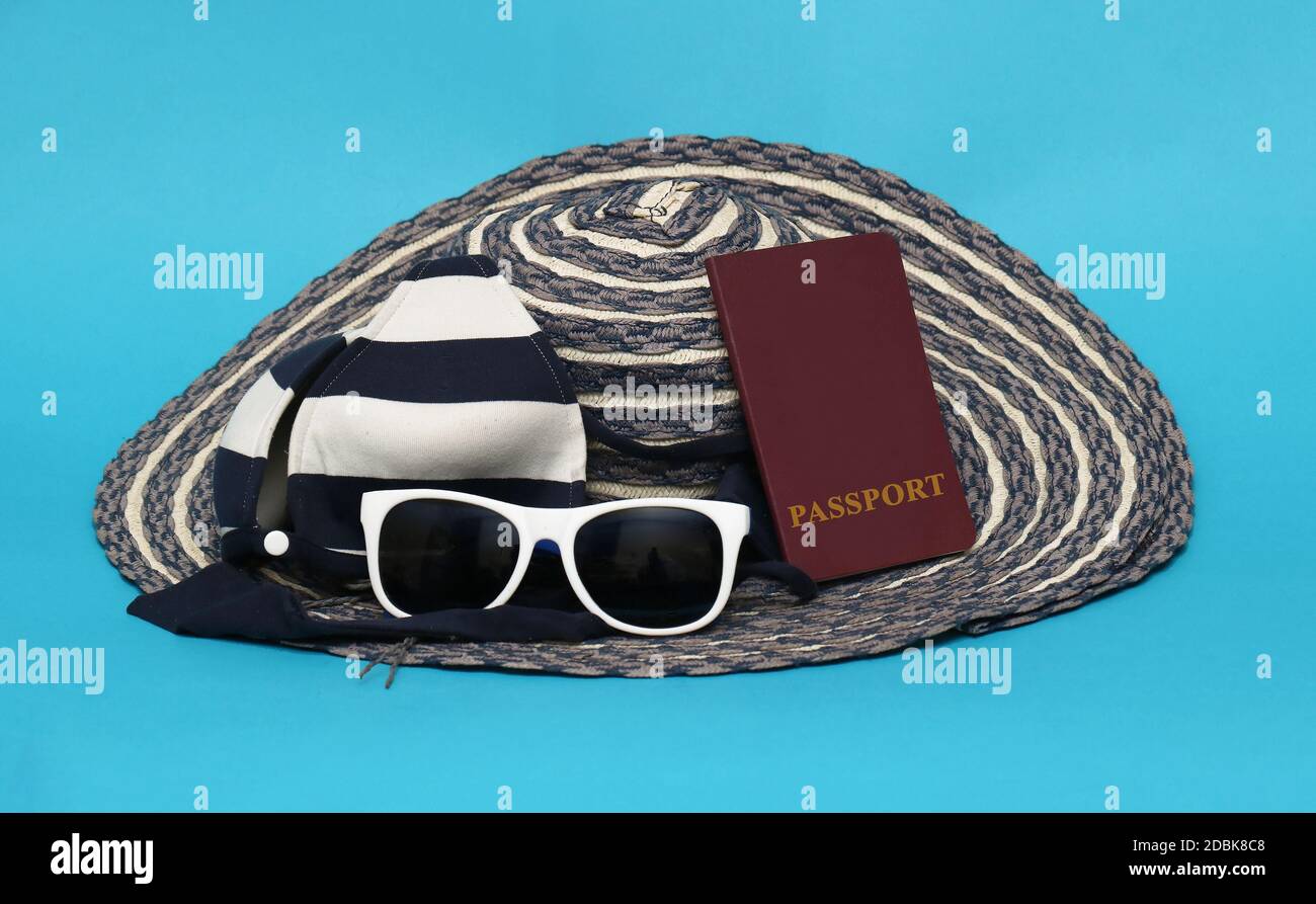 Hat, bathing suit sunglasses and passport ready for summer vacation ...