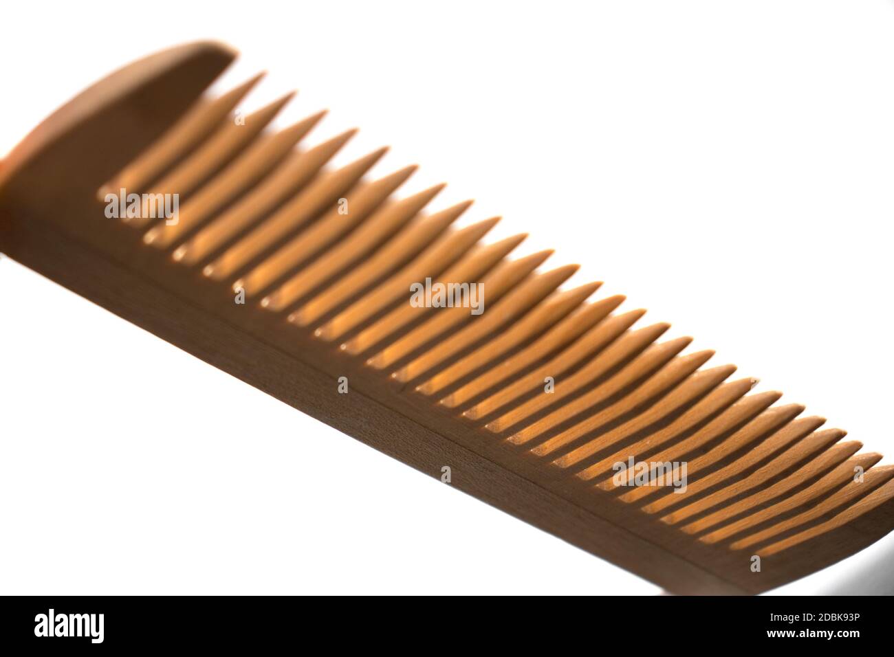 Thin comb of light wood on a white background Stock Photo - Alamy