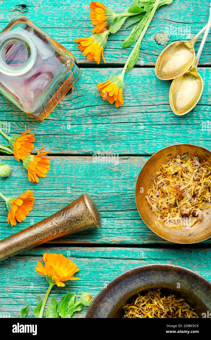 Medicinal tincture of calendula flowers healing herbs in alternative medicine Stock Photo - Alamy