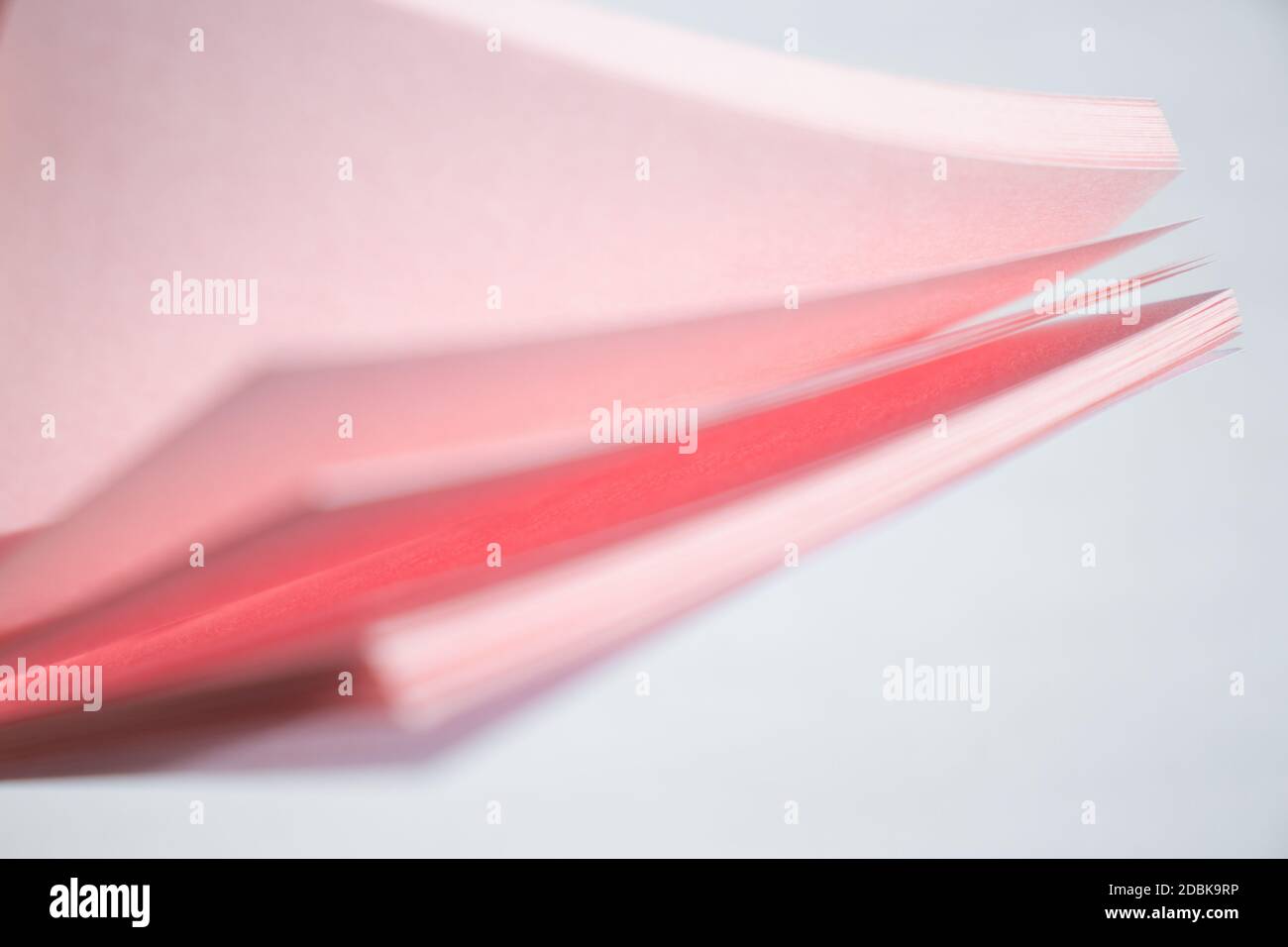 Pink paper sheets for notes on white background Stock Photo - Alamy