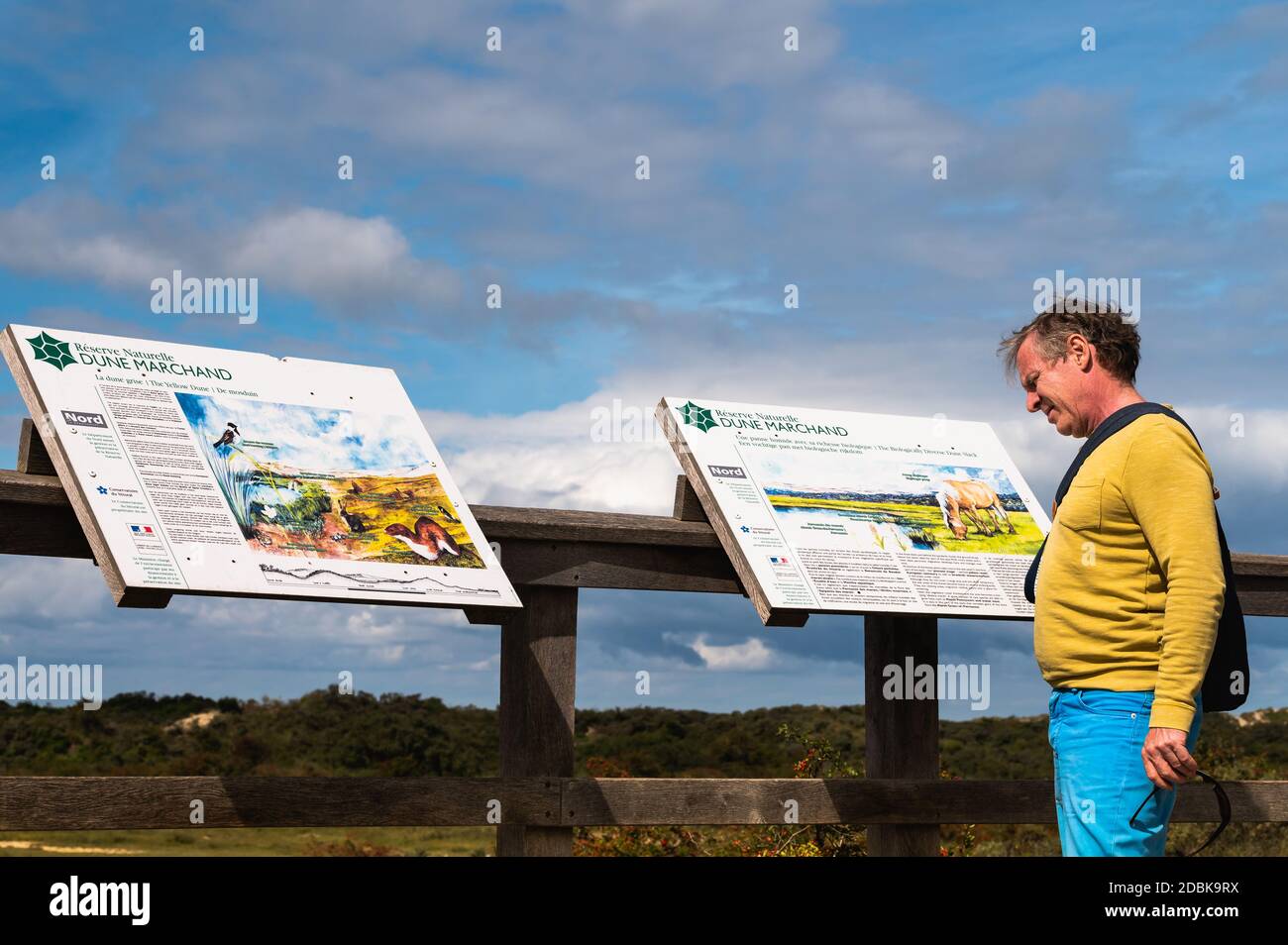 A tourist reads the explanatory panels of a nature reserve Stock Photo ...