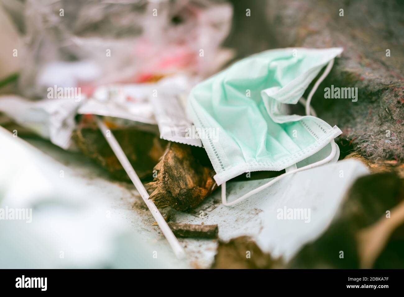 Used face mask discard in household garbage. Medical waste disposal ...