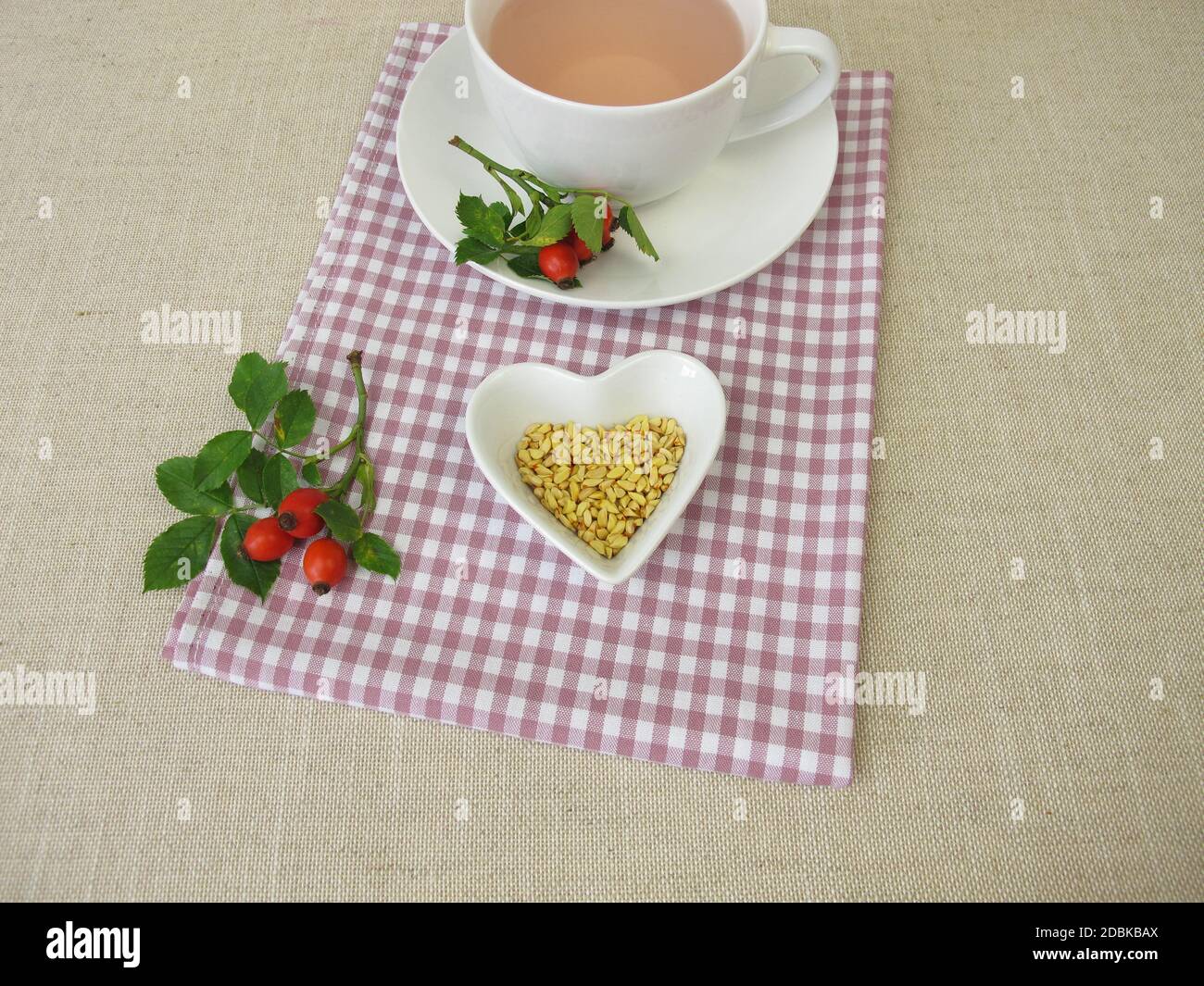 A cup of kernels tea from rose hip seeds Stock Photo - Alamy