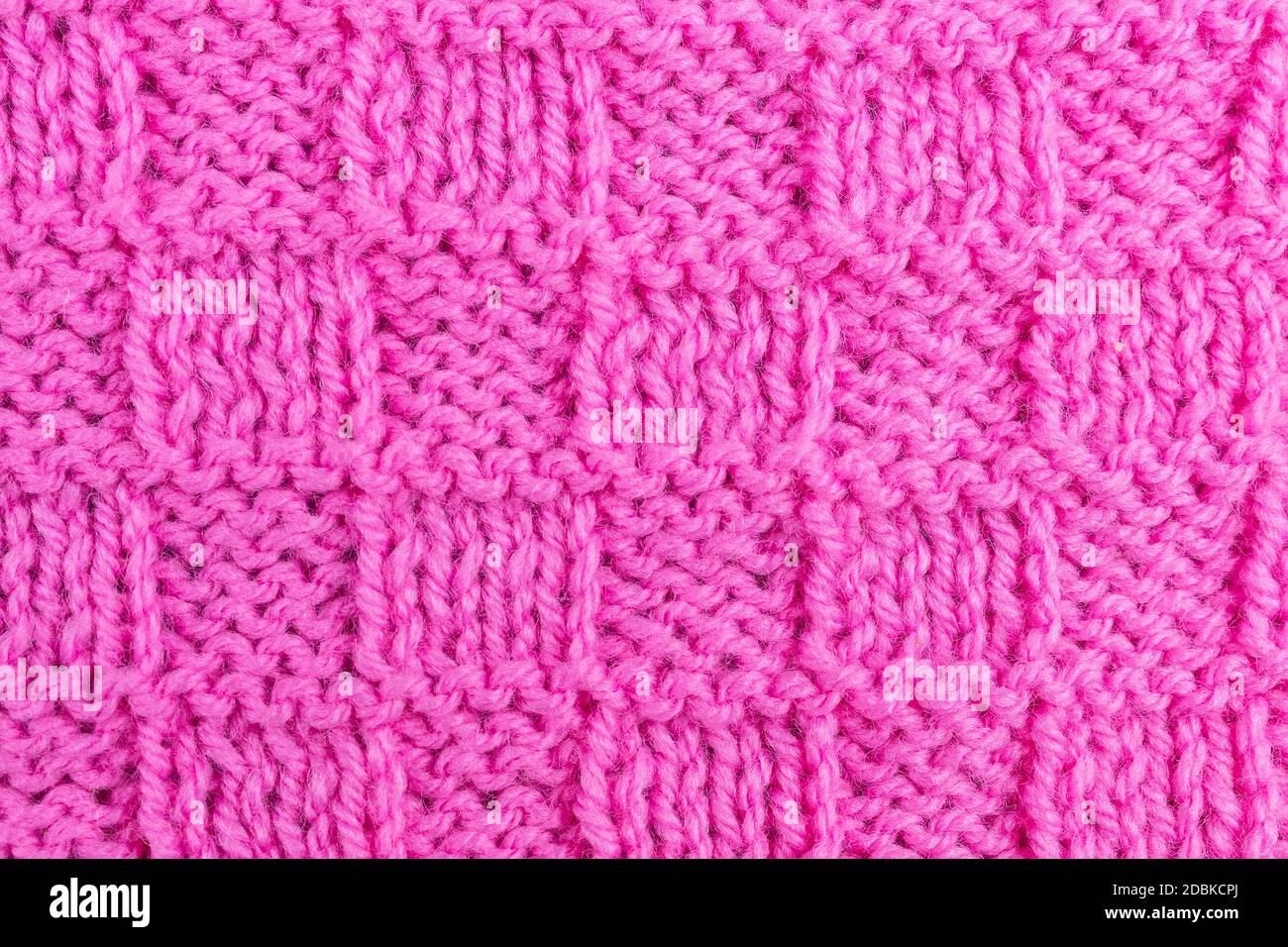 Pink seamless knit pattern. Woolen fabric. Christmas red knitted ...