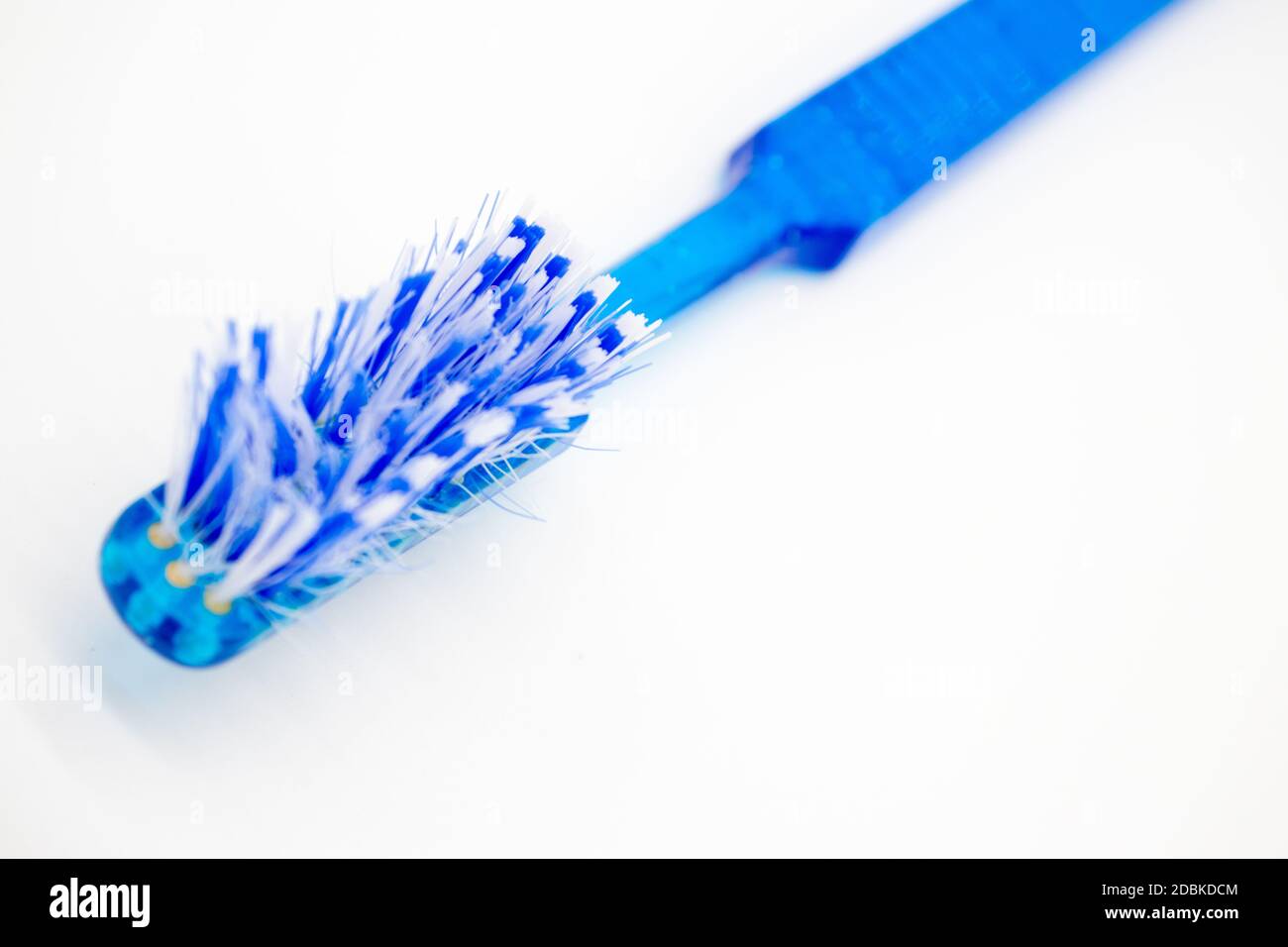Old blue toothbrush isolated on white background Stock Photo - Alamy