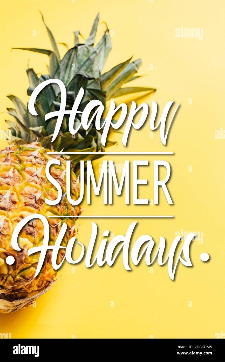 fresh ripe pineapple on yellow background with happy summer holidays ...