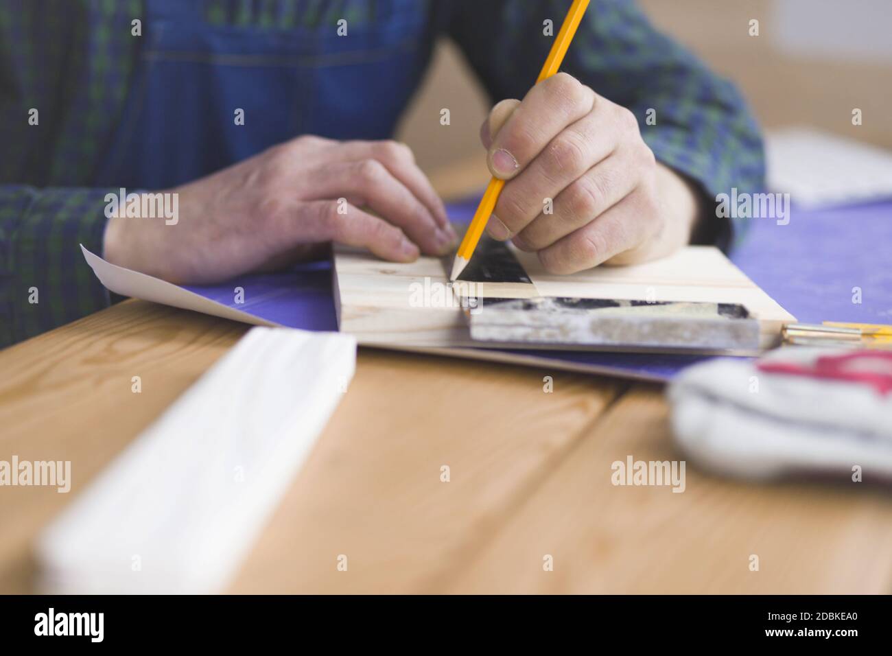 Engineer carpenter working on laptop and sketching project Stock Photo ...
