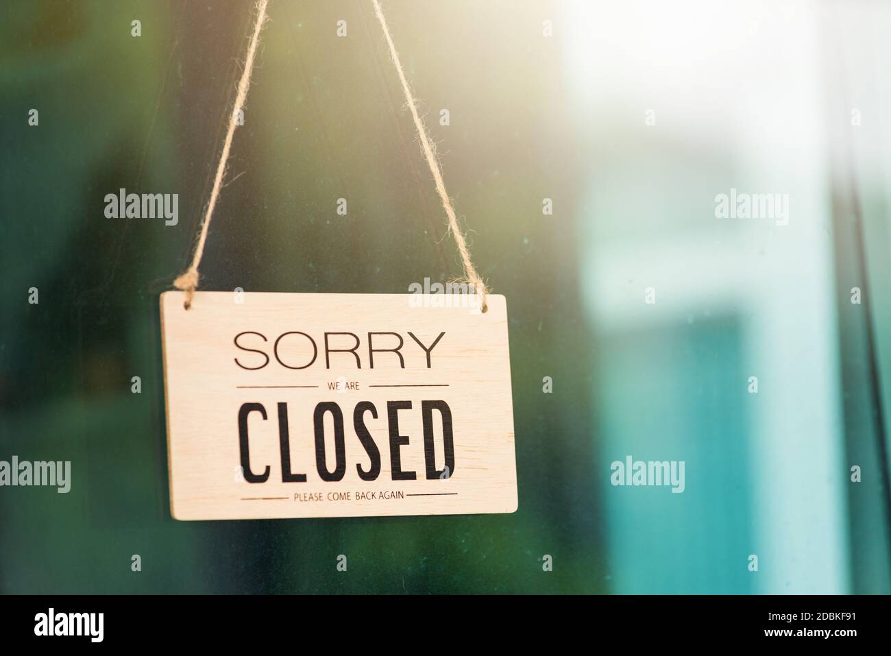 Close up of SORRY WE ARE CLOSED PLEASE COME BACK AGAIN notice sign wood ...