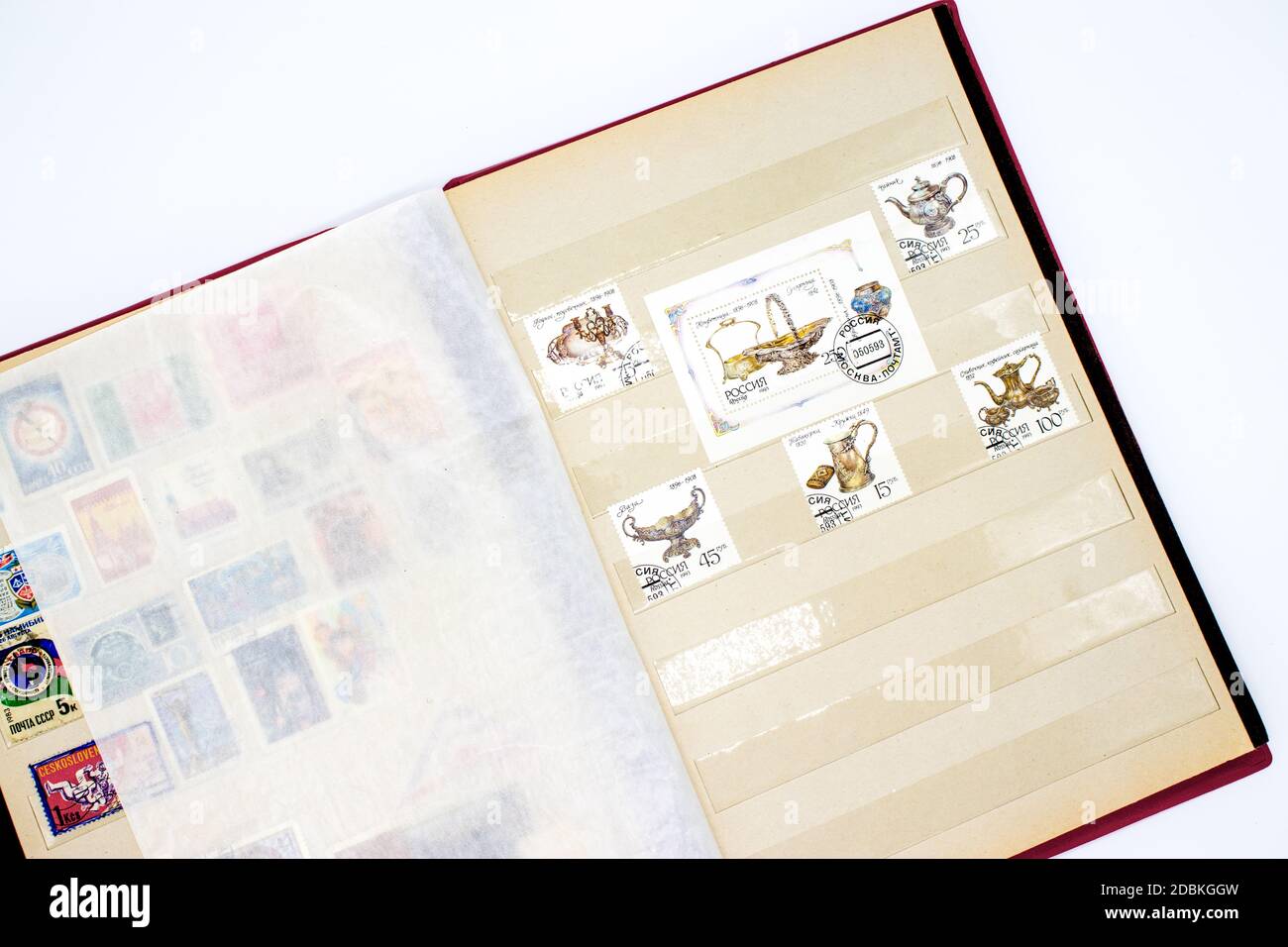 Album of used stamps isolated on white background Stock Photo - Alamy