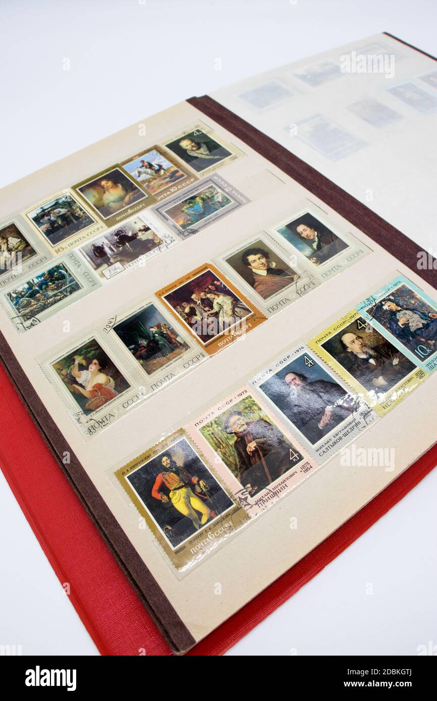 Album of used stamps isolated on white background Stock Photo - Alamy