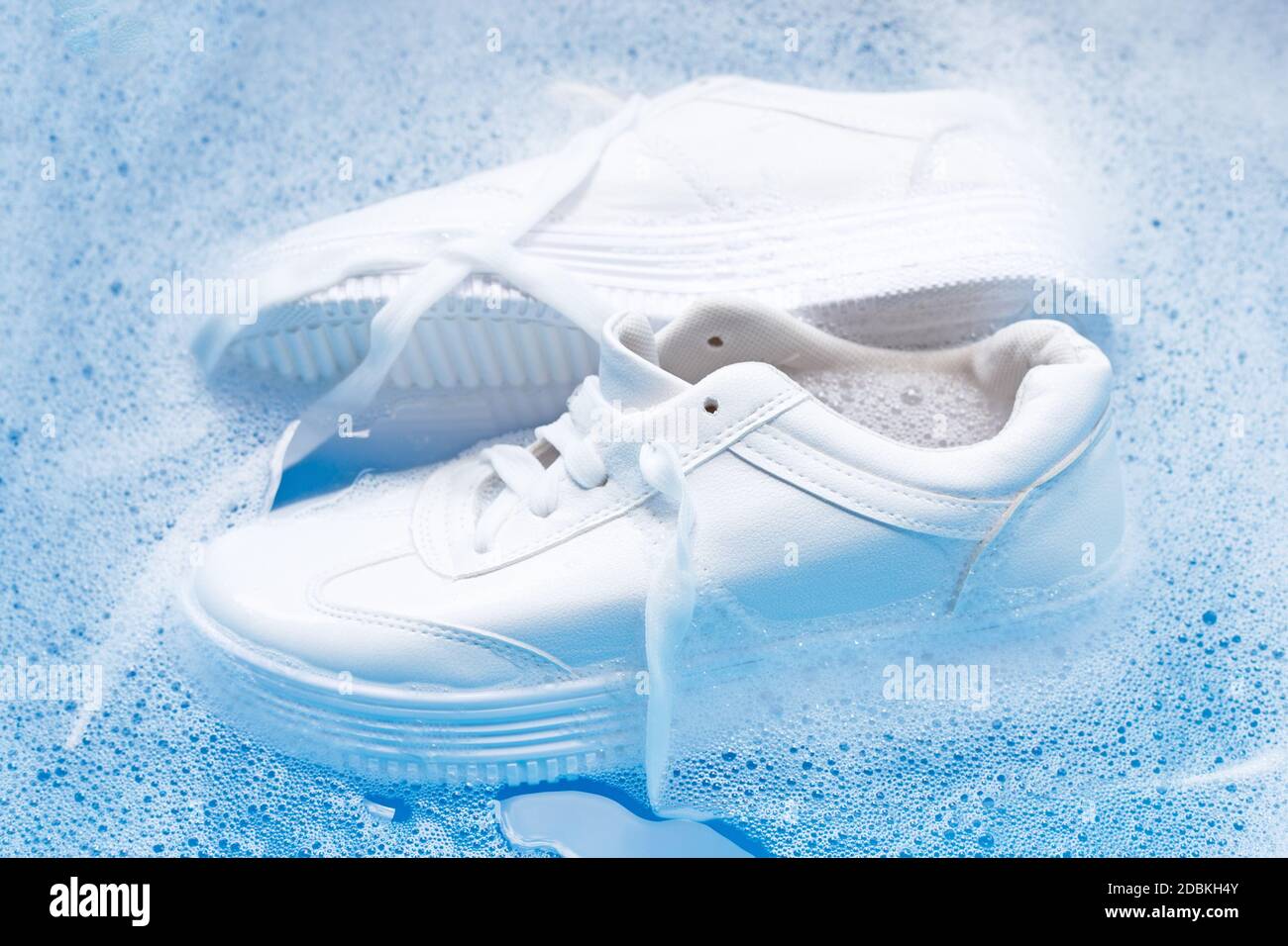 Soak shoes before washing. Cleaning Dirty sneakers Stock Photo - Alamy