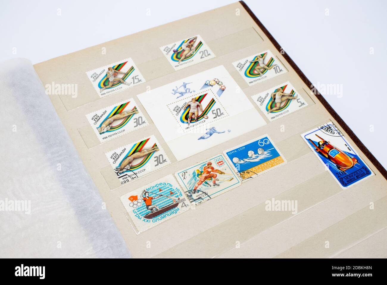 Album of used stamps isolated on white background Stock Photo - Alamy