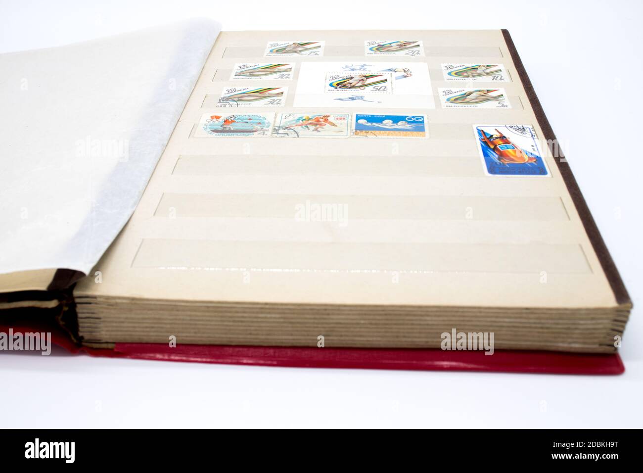 Album of used stamps isolated on white background Stock Photo - Alamy