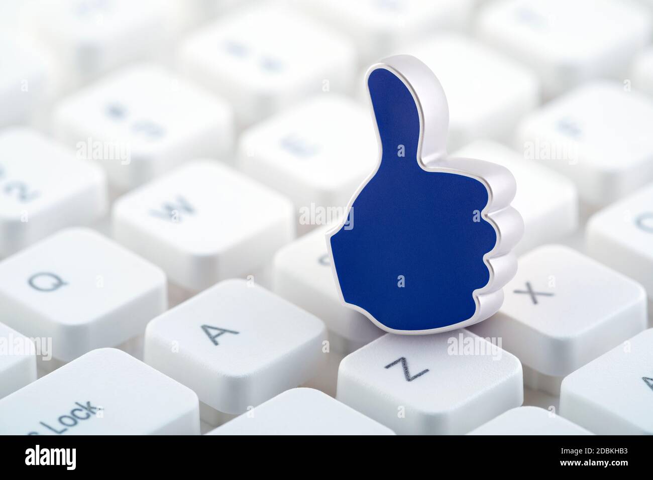 Thumb Up graphic illustration on computer keyboard Stock Photo - Alamy