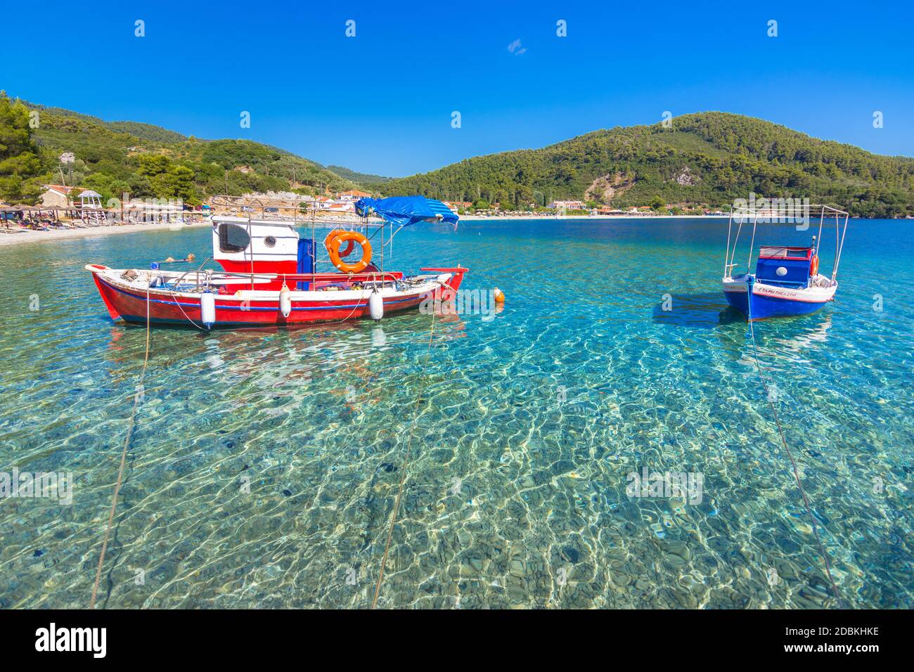 Amazing beach of Panormos, Skopelos with traditional fishing boats ...