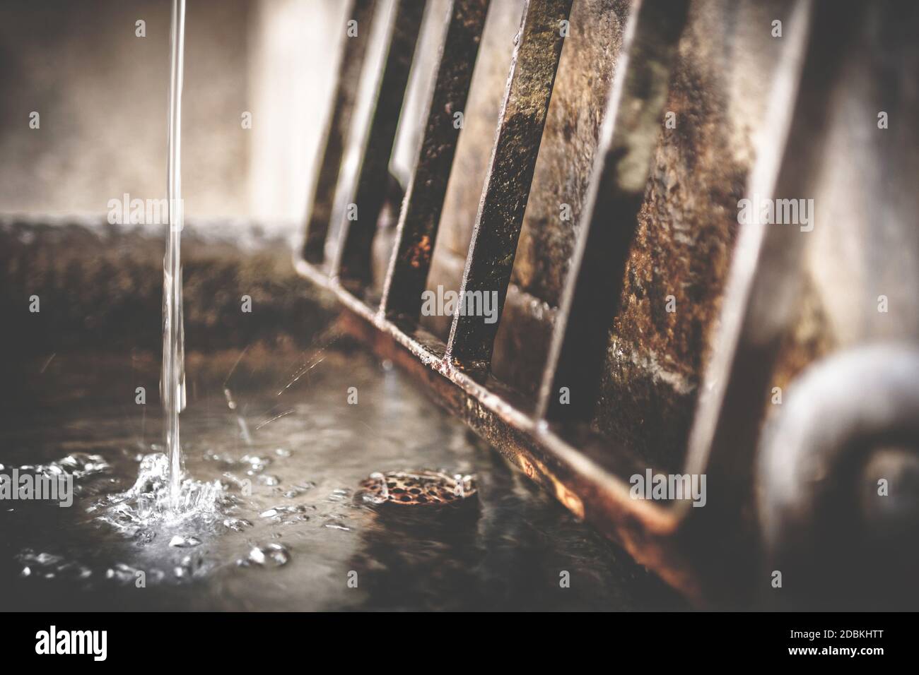 Old rusty fountain. Rustic old metal outdoor running water feature ...