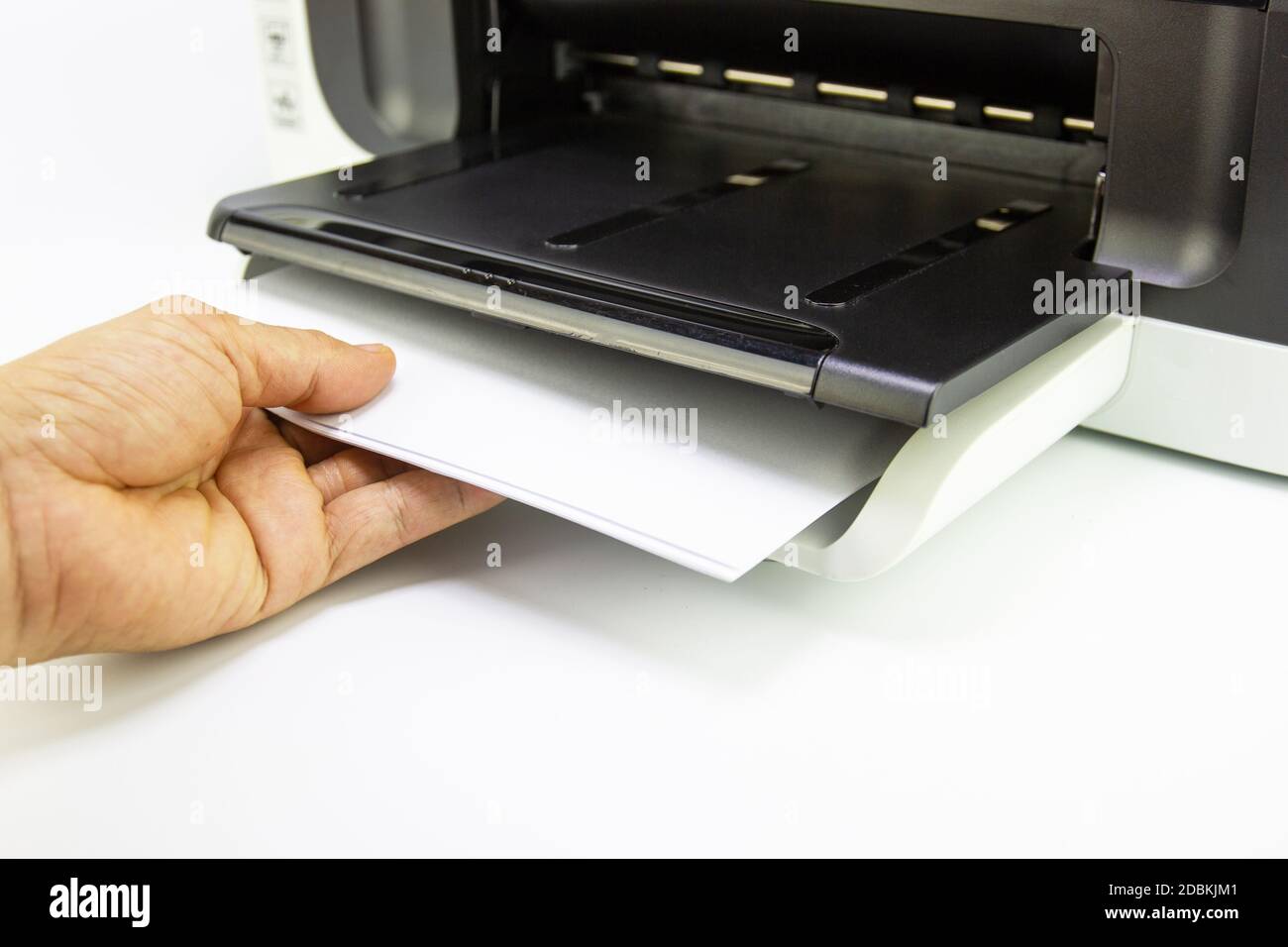 hand man lay down the paper from printer in the office, Business ...