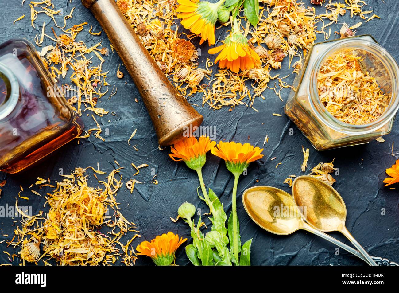 Medicinal tincture of calendula flowers, medicinal wild herbs Stock ...