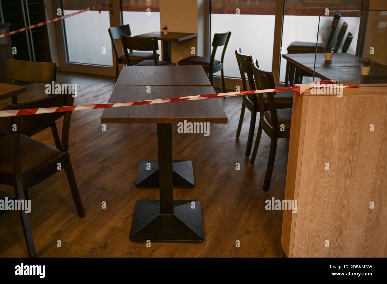 Warning tape blocks a cafe, which has to close during lockdown due to ...