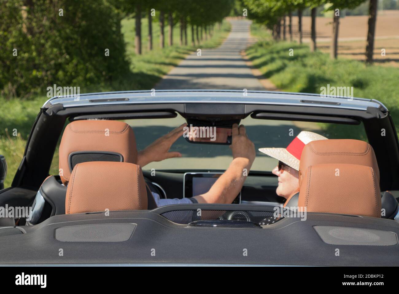 Older couple driving convertible car enjoying the day Stock Photo - Alamy