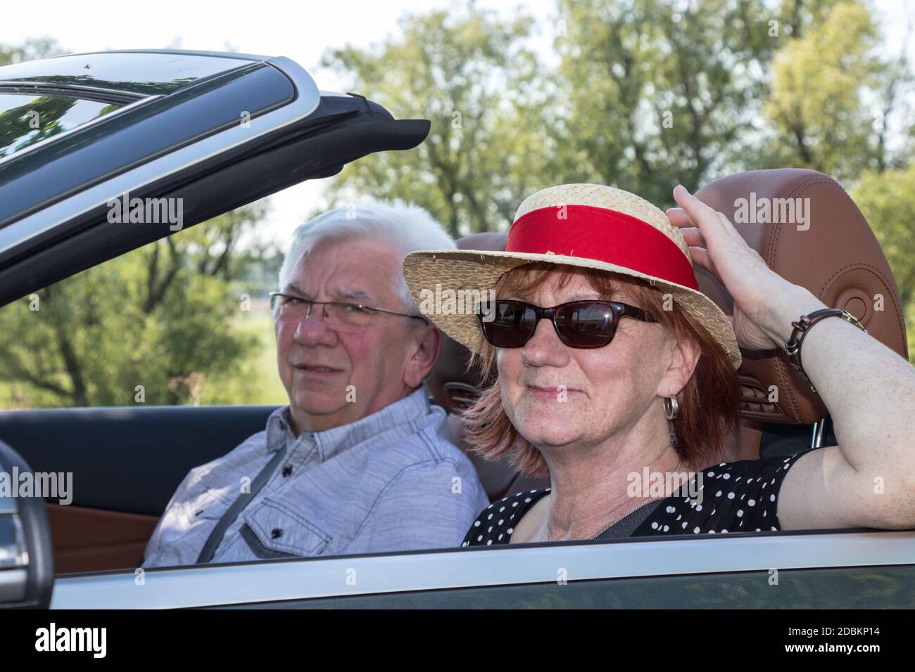 Happy elderly couple sports car hi-res stock photography and images - Alamy