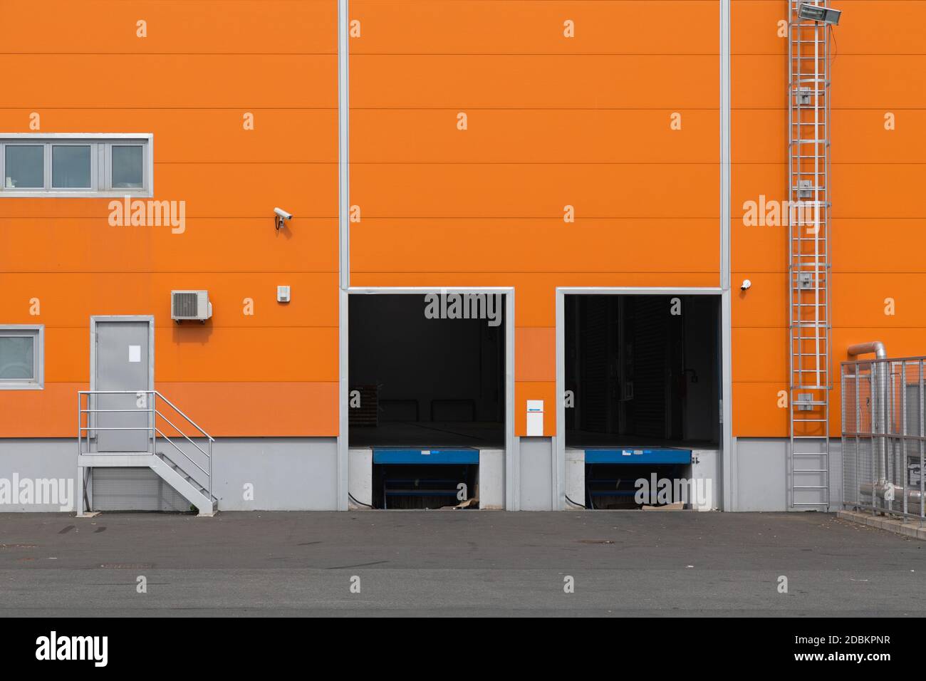 Two Cargo Doors at Orange Distribution Warehouse Stock Photo - Alamy