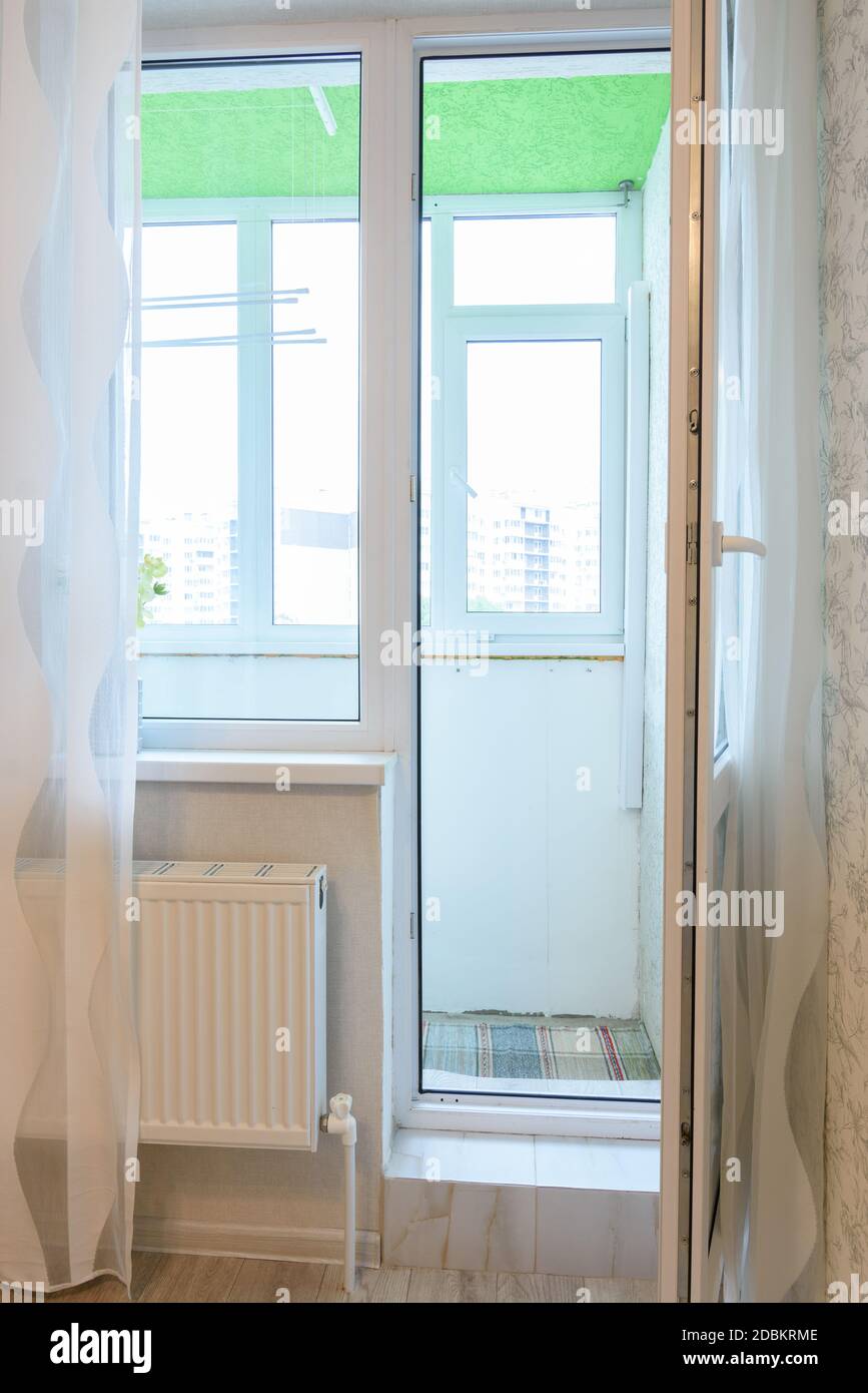 Exit to a glazed balcony from a room in a multi-storey building Stock ...