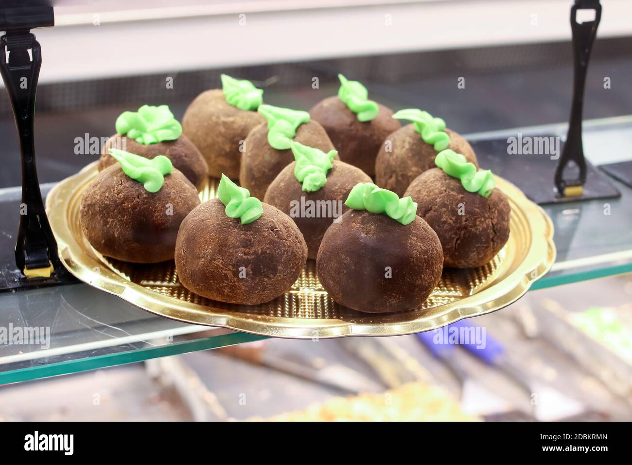 Bright cakes on a shop window close up Stock Photo - Alamy