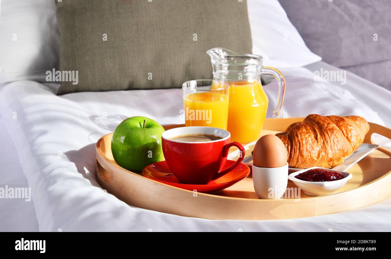 Breakfast on tray in bed in hotel room Stock Photo - Alamy