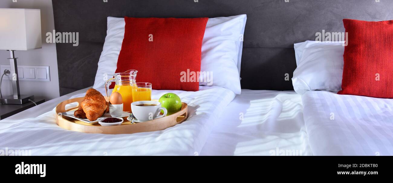 Breakfast on tray in bed in hotel room Stock Photo - Alamy