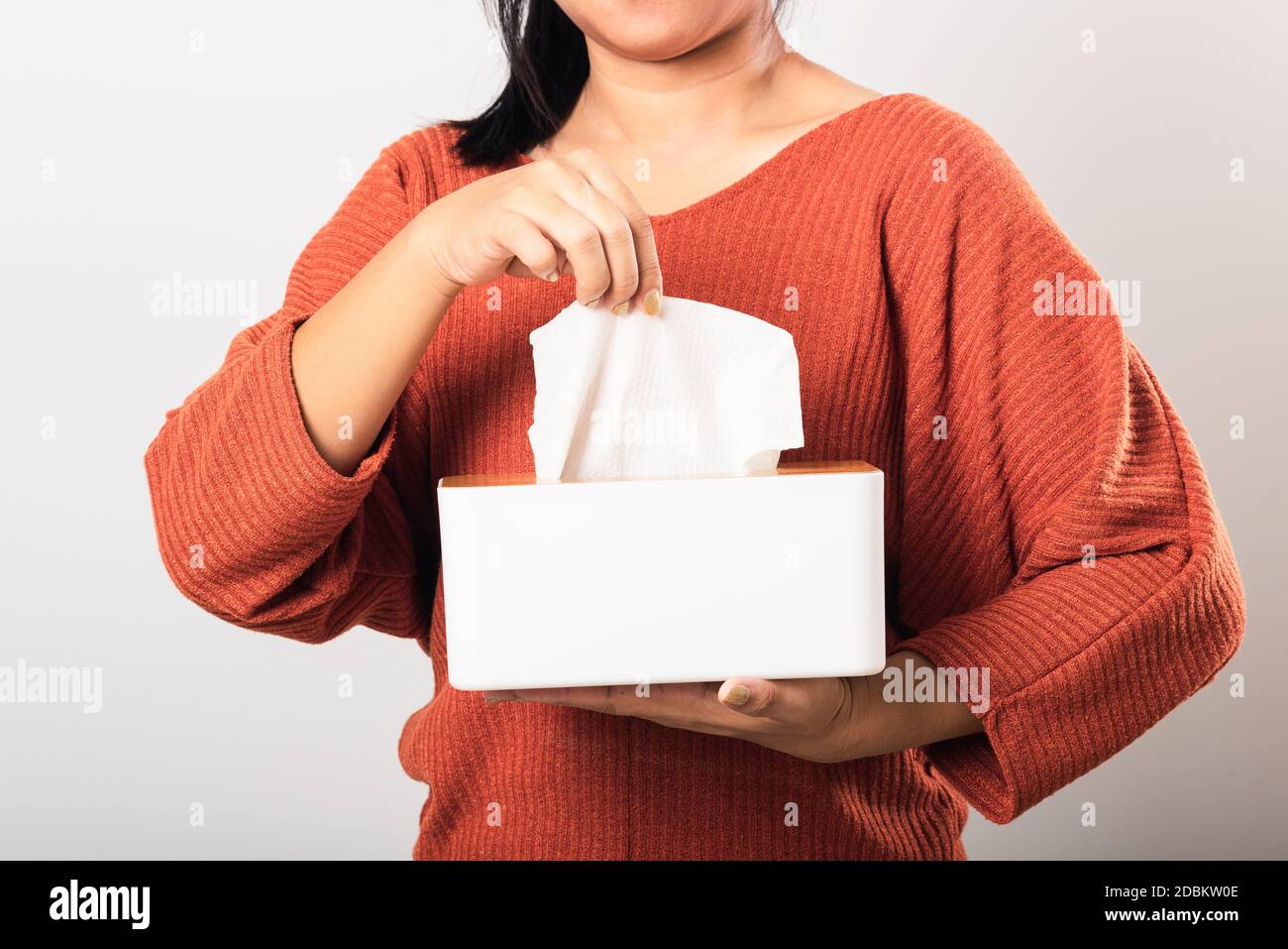 Young woman flu she using hand taking pulling white facial tissue out ...