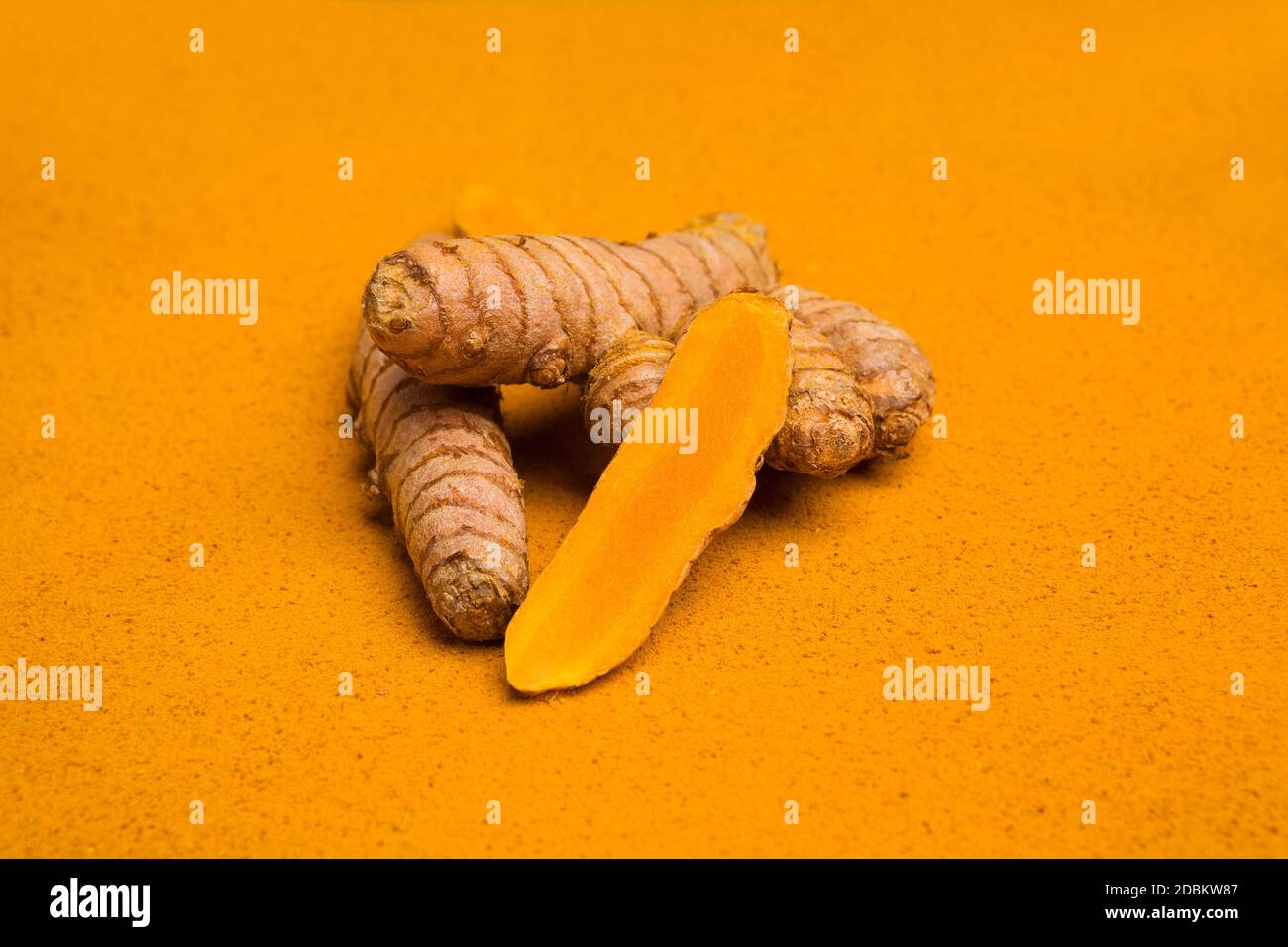 Turmeric root and curcuma spice background. Herbal medicine, nutrional ...