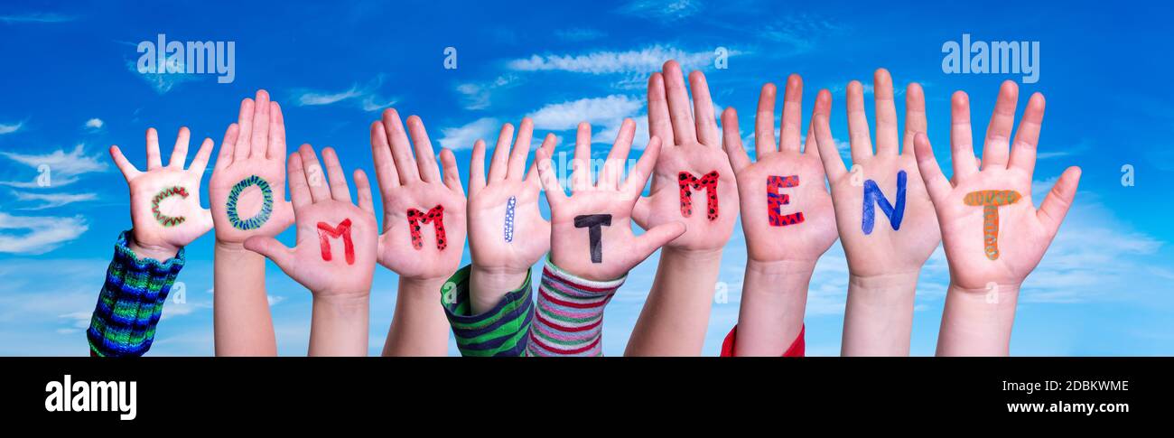 Children Hands Building Colorful Word Commitment. Blue Sky As ...