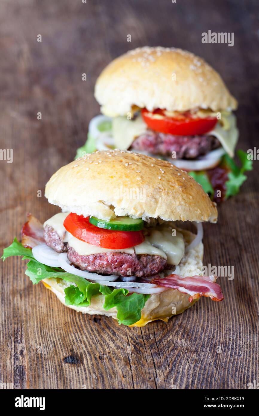 home made hamburger on rustic wood Stock Photo - Alamy