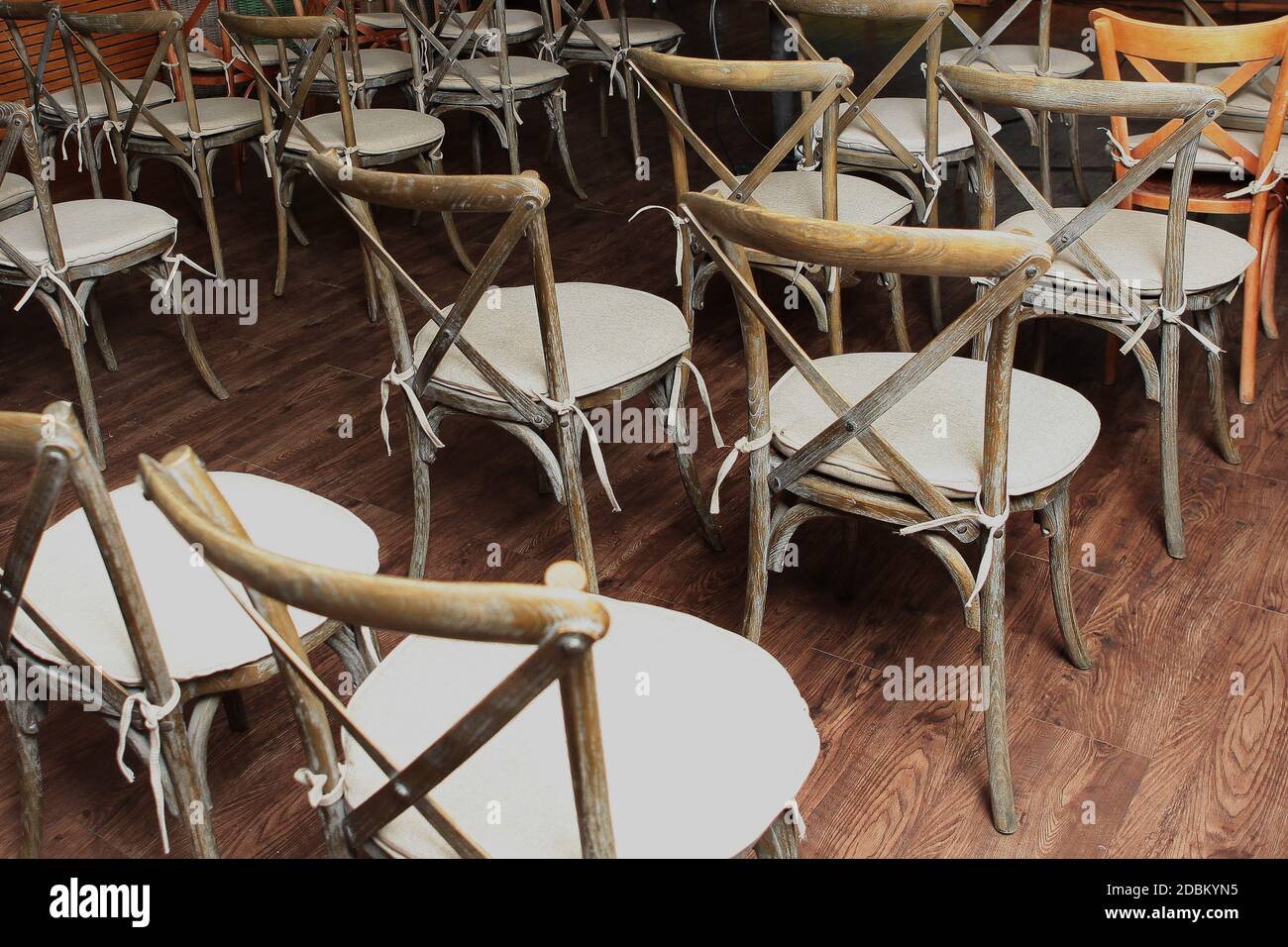 A large number of vintage chairs in the basement. Conference venues ...
