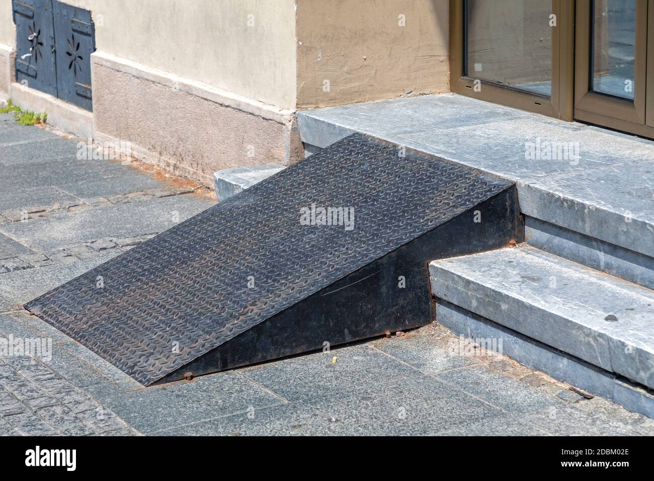 Wheelchair Ramp at Building Entrance From Street Stock Photo - Alamy