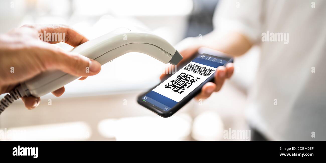 Using Mobile Phone To Scan Payment Code In Shop Stock Photo - Alamy