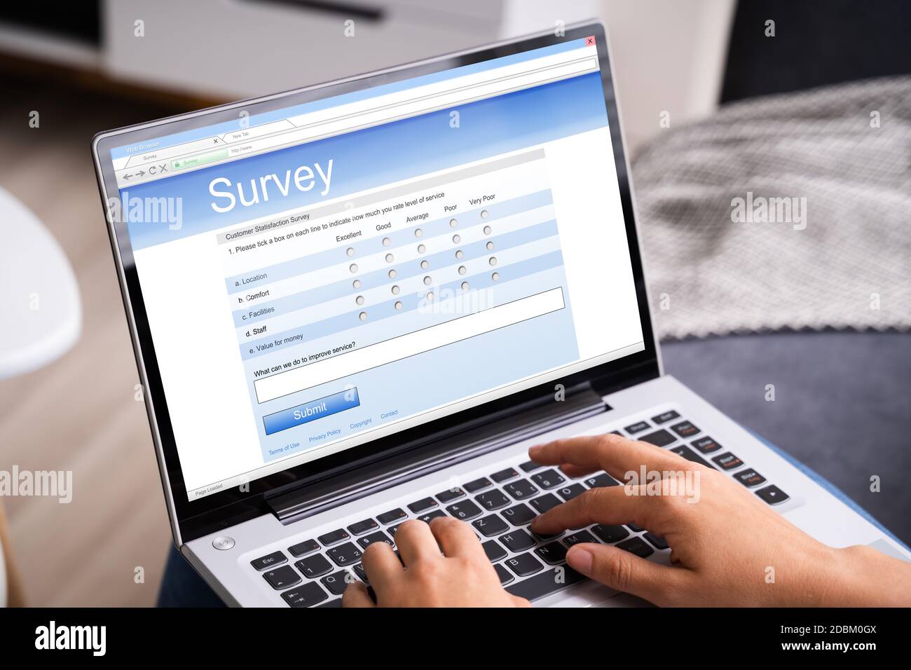 Woman Looking At Online Survey Laptop Computer At Home Stock Photo - Alamy