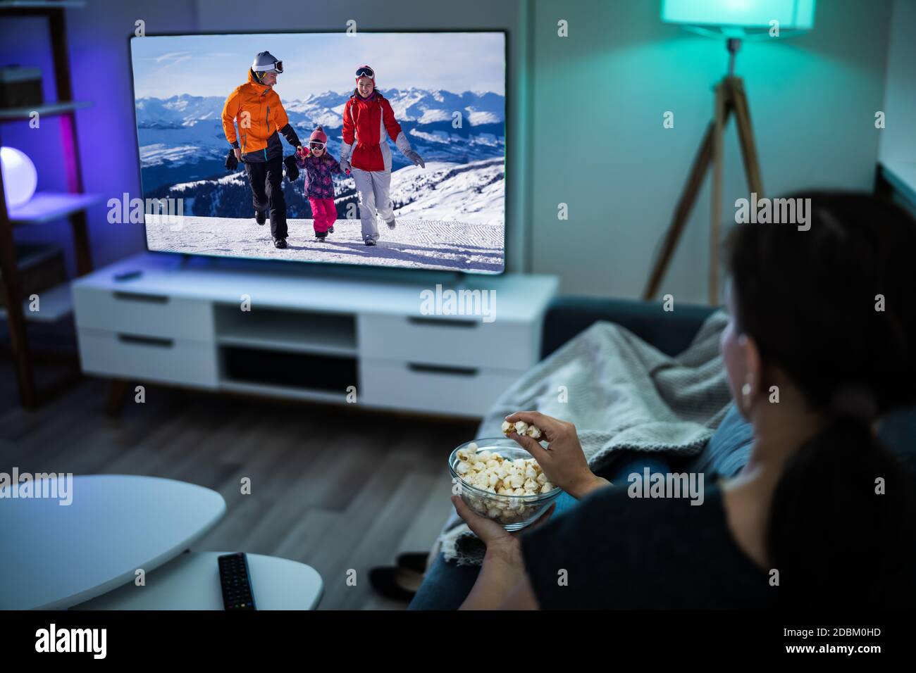 Woman Watching TV On Couch Or Sofa. Watch Television Stock Photo - Alamy