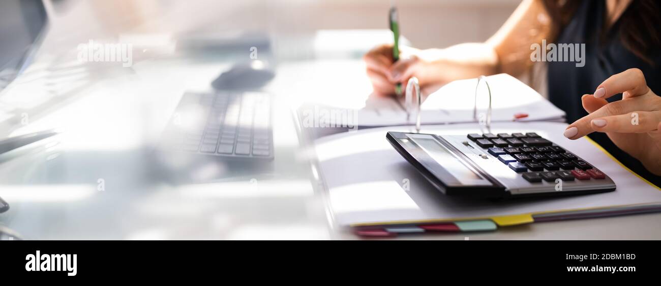 Chartered Accountant Hand Calculating Tax And Salary Stock Photo - Alamy