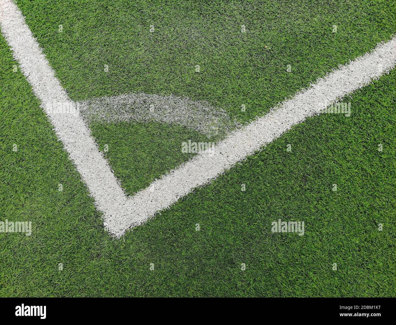 A corner arc marking on green grass pitch Stock Photo - Alamy