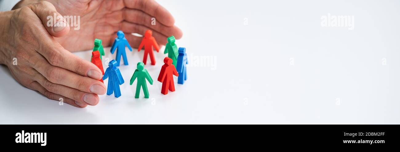 Business Executive Hand Protecting Employee Figures Concept Stock Photo ...