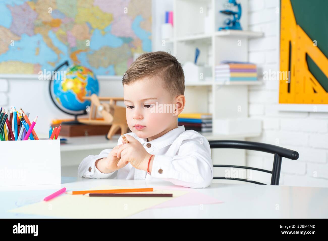 Elementary school boy. Concept of education and reading. Pupil in class ...