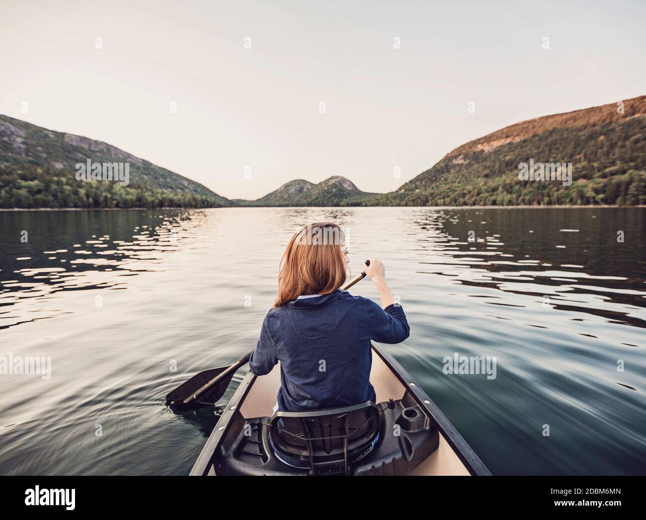Woman canoeing in Jordan Pond, Acadia National Park, Maine, USA Stock ...