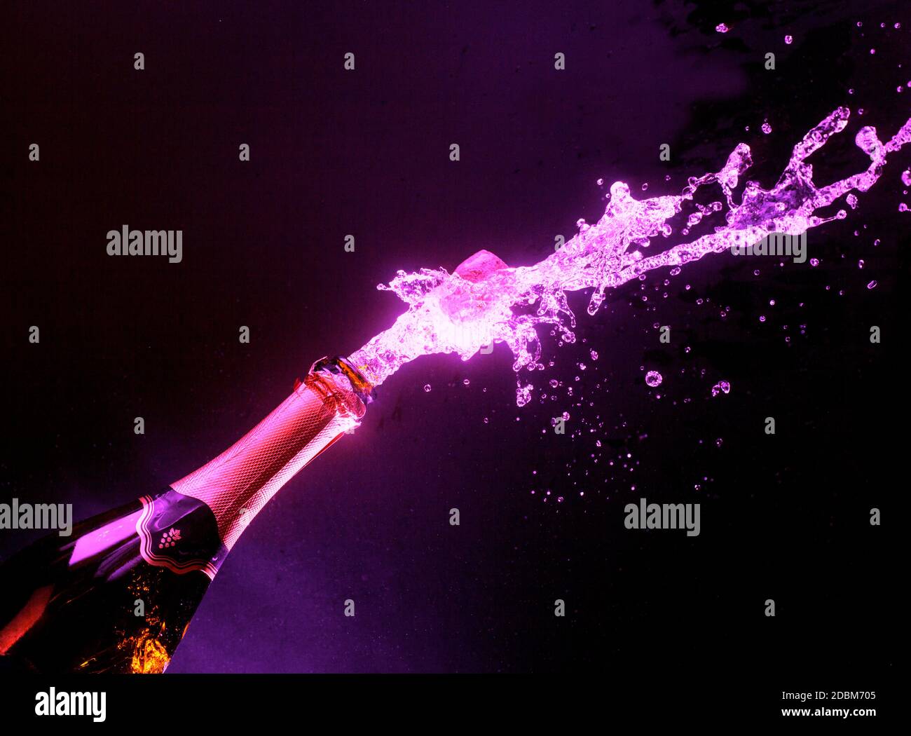 Celebration theme with splashing champagne Stock Photo - Alamy